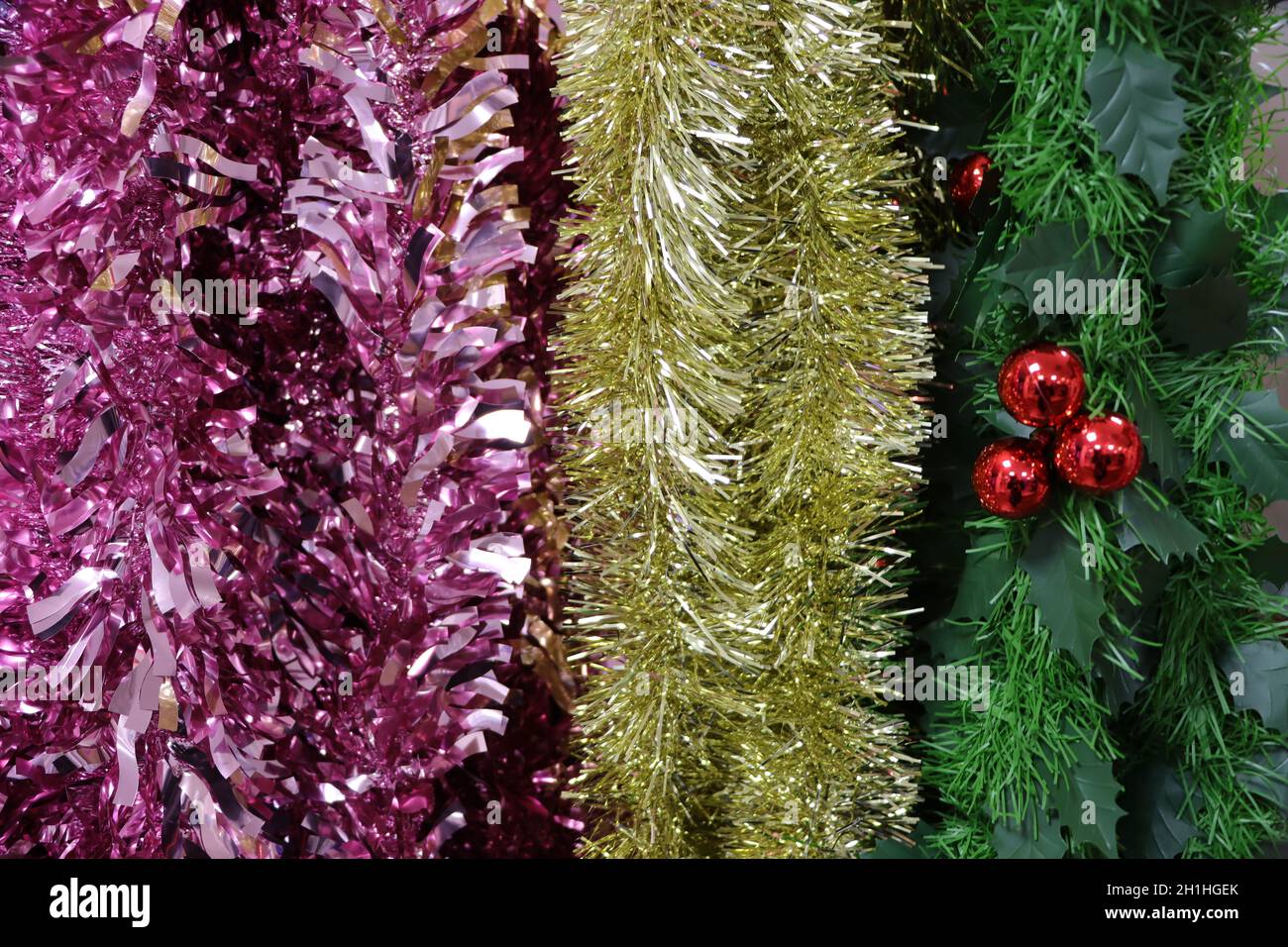 Christmas colorful tinsel decoration for new year Stock Photo - Alamy