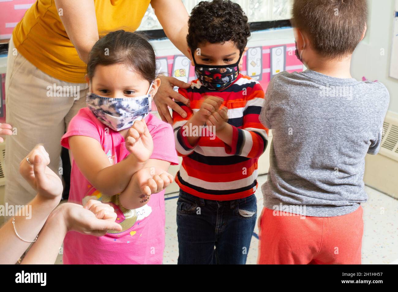 Education Preschool 4-5 year olds group doing music activity hand ...