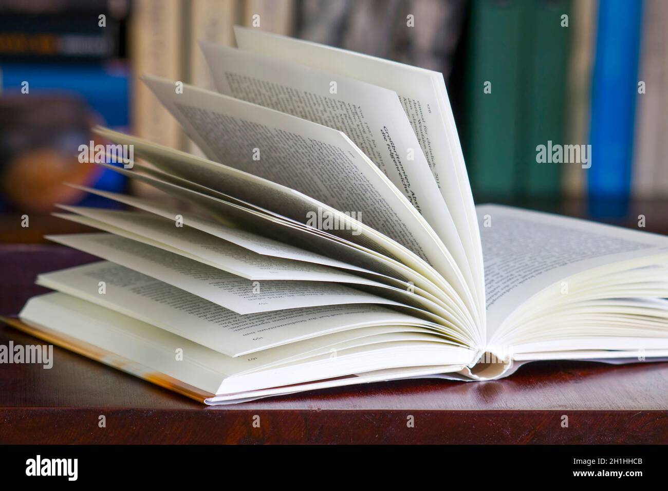 open book on the desk Stock Photo - Alamy