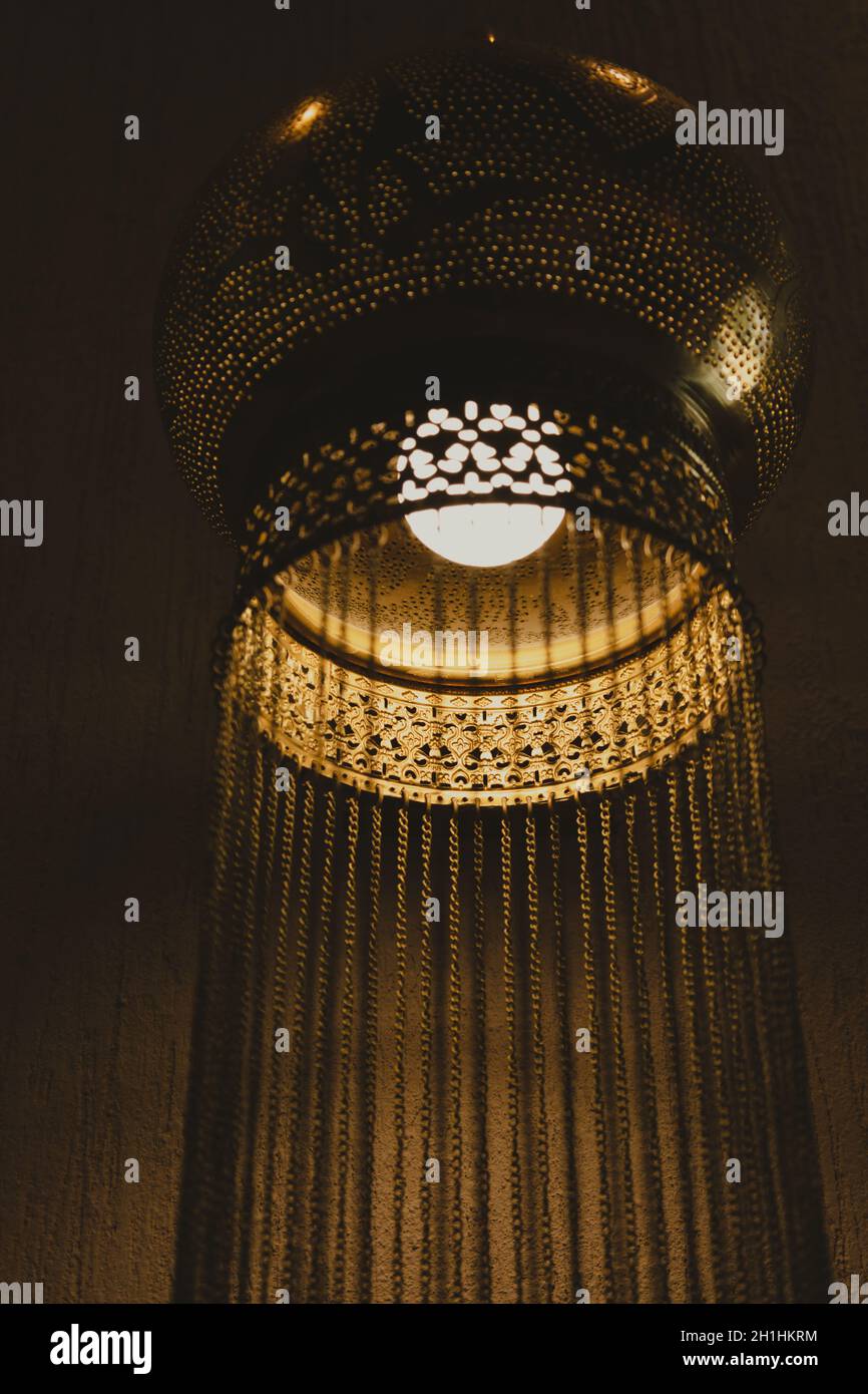 Traditional Oriental lamp. Lacy metal Arabic hanging lamp with long ...