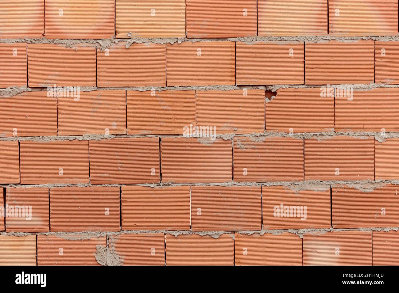 Pile of clay bricks used for building masonry house. The image shows ...
