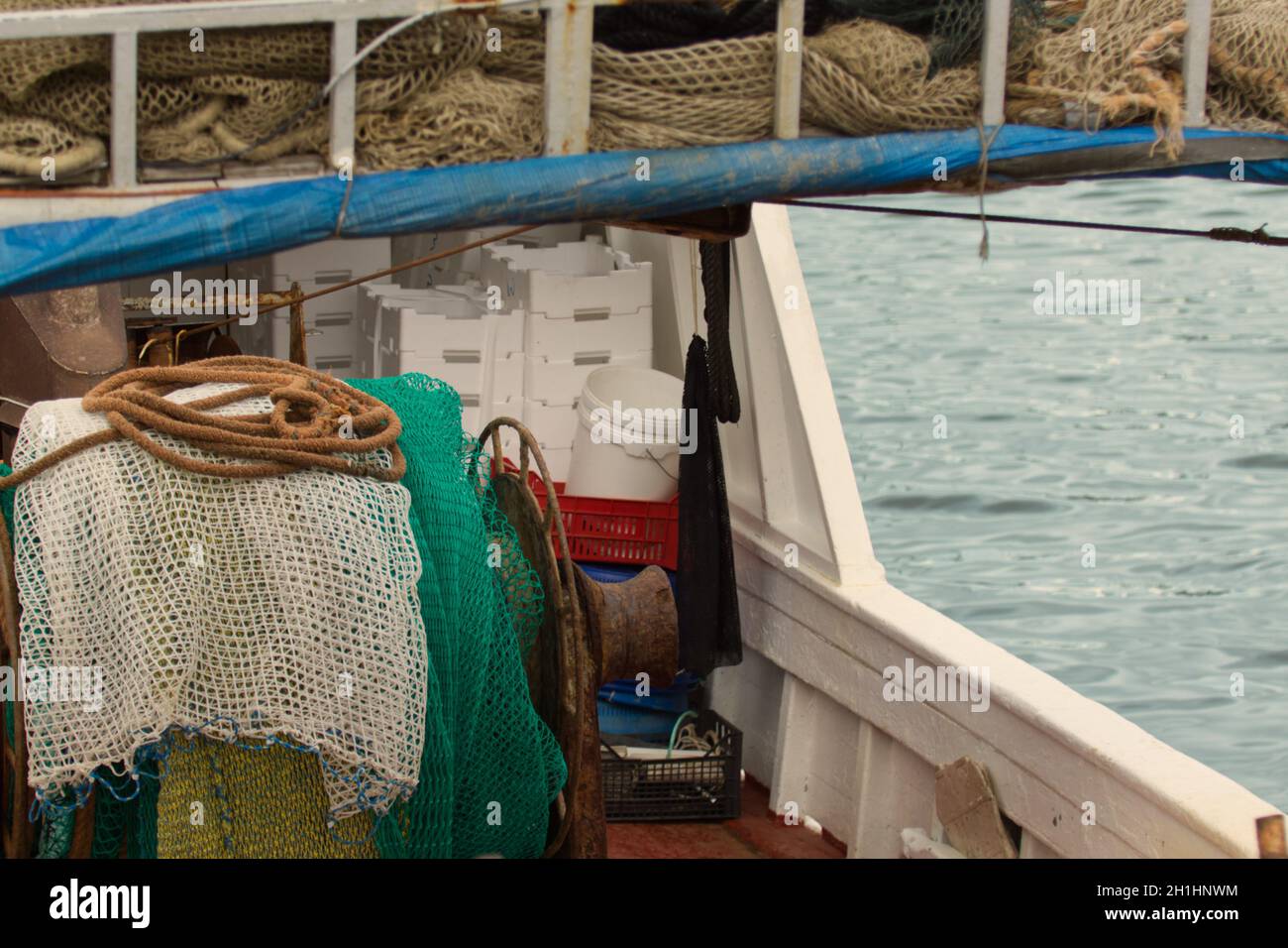 stern of an Italian fishing boat with nets ready for fishing. High ...