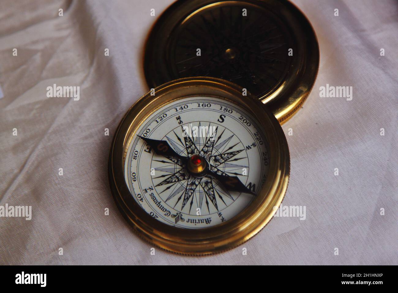 Antique brass compass on map hi-res stock photography and images - Alamy