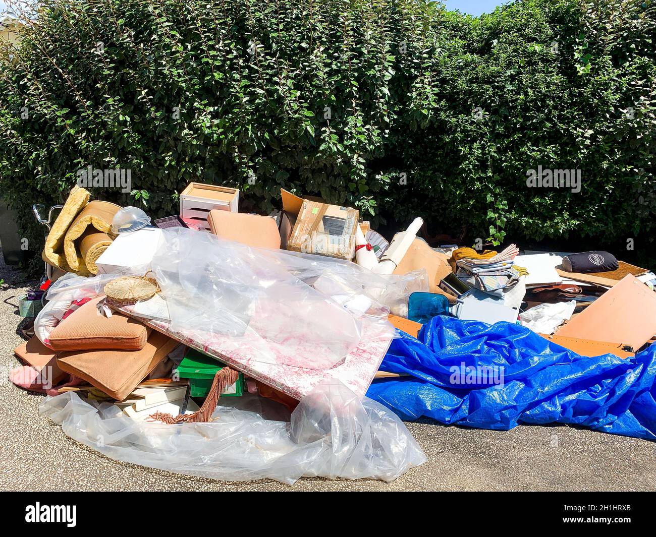 Bulky waste piled in the courtyard of a private house, Bron, Rhone ...