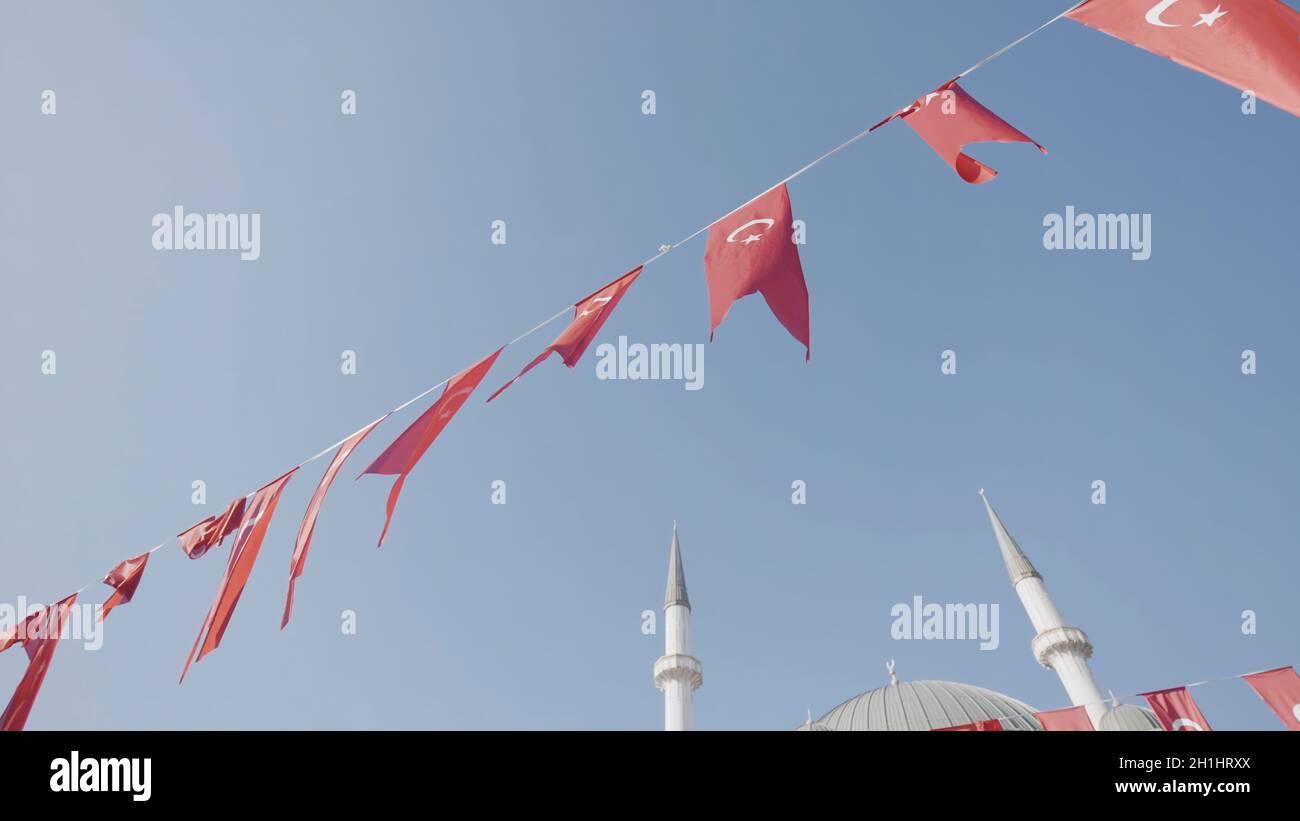 Turkish flags on rope. Action. Flags of Turkey are festively hung on ...