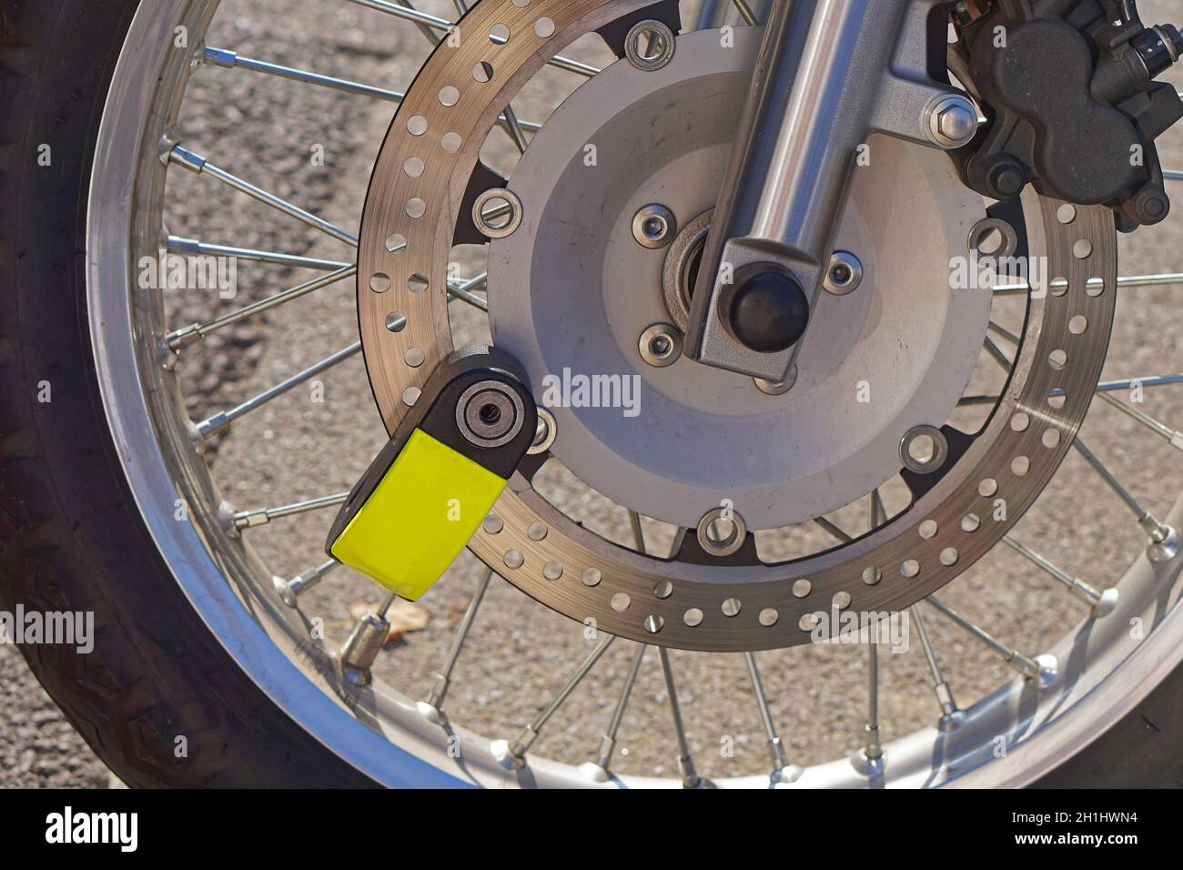 Disc brake lock with alarm motorcycle safety Stock Photo - Alamy