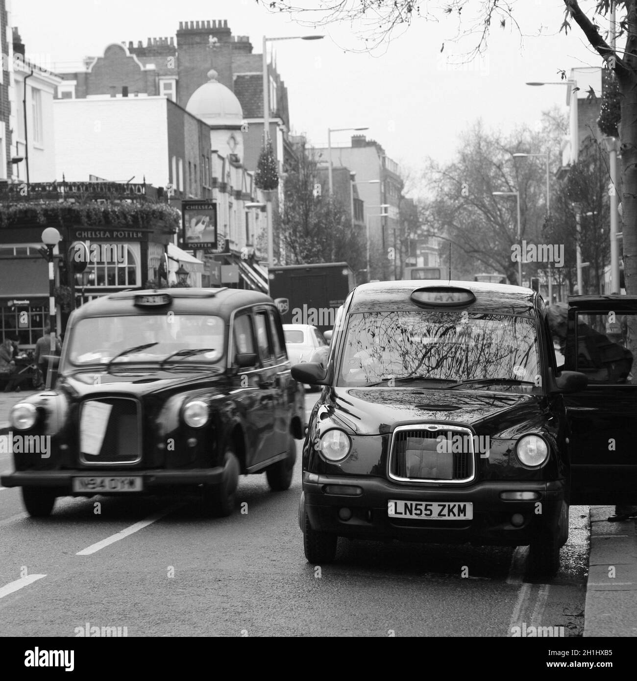 London, UK - October 29, 2010: Taxi in the street of London. Cabs are ...