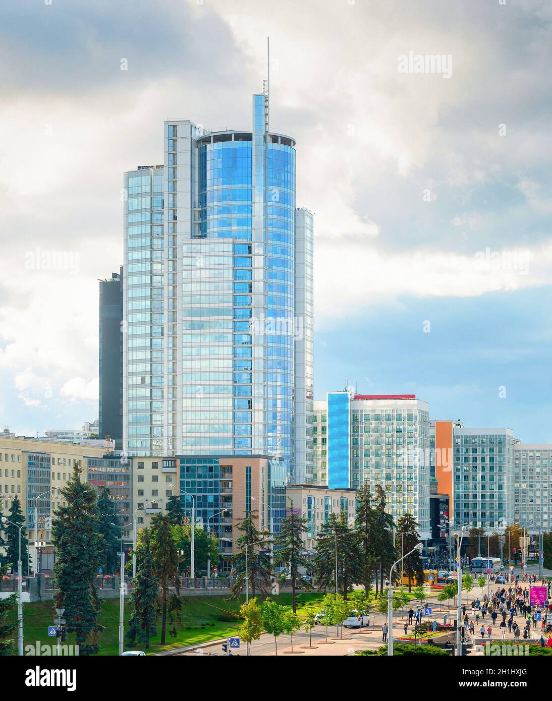Cloudy cityscape of Minsk downtown with modern architecture and green ...
