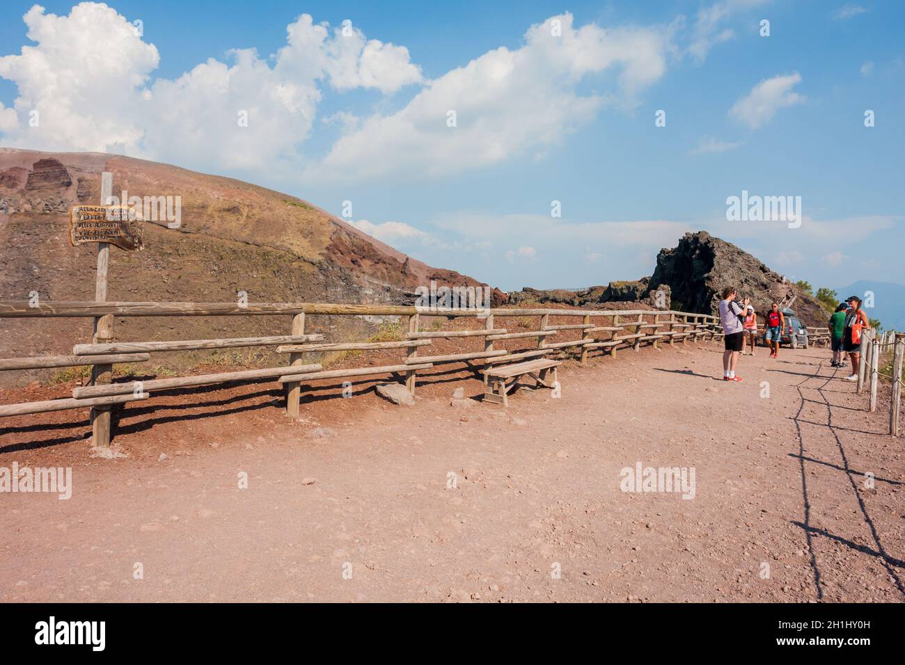 MOUNT VESUVIUS, ITALY - AUGUST 1, 2018: Tourists walk around the crater ...