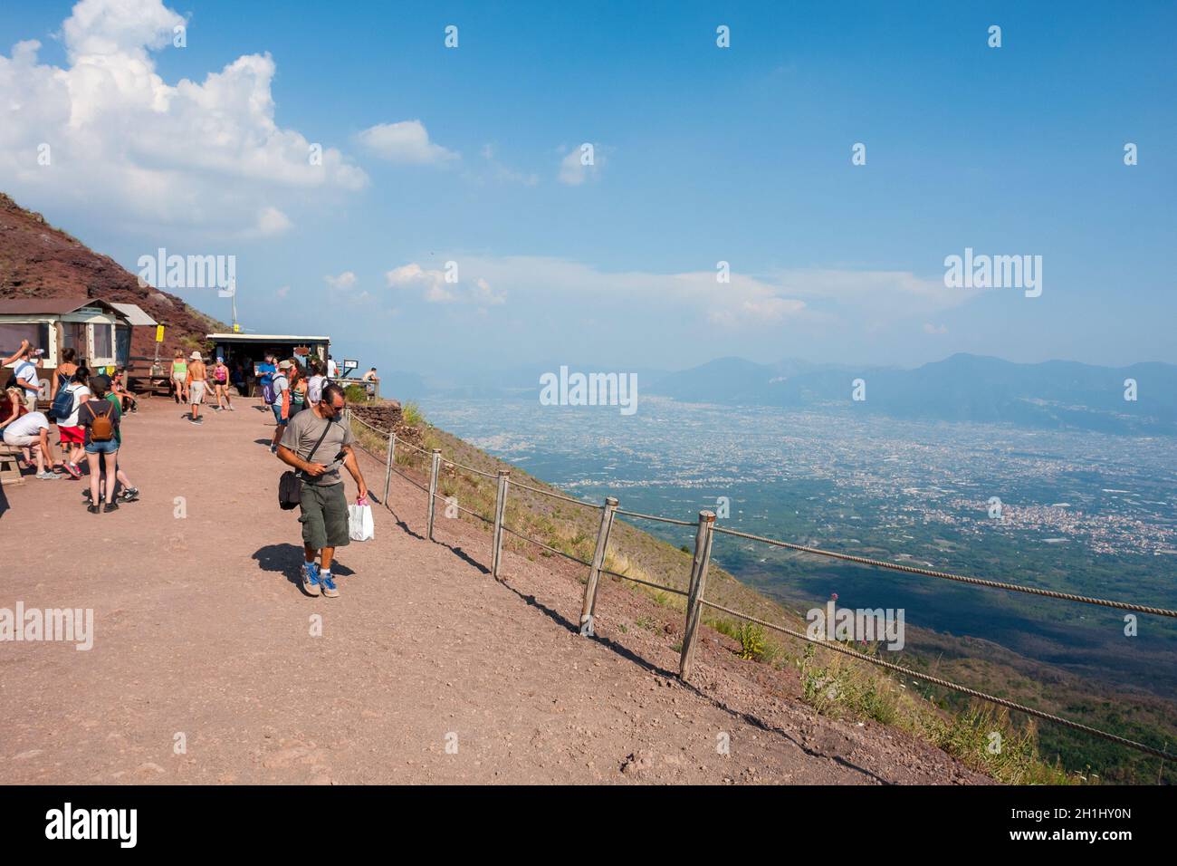 MOUNT VESUVIUS, ITALY - AUGUST 1, 2018: Tourists walk around the crater ...