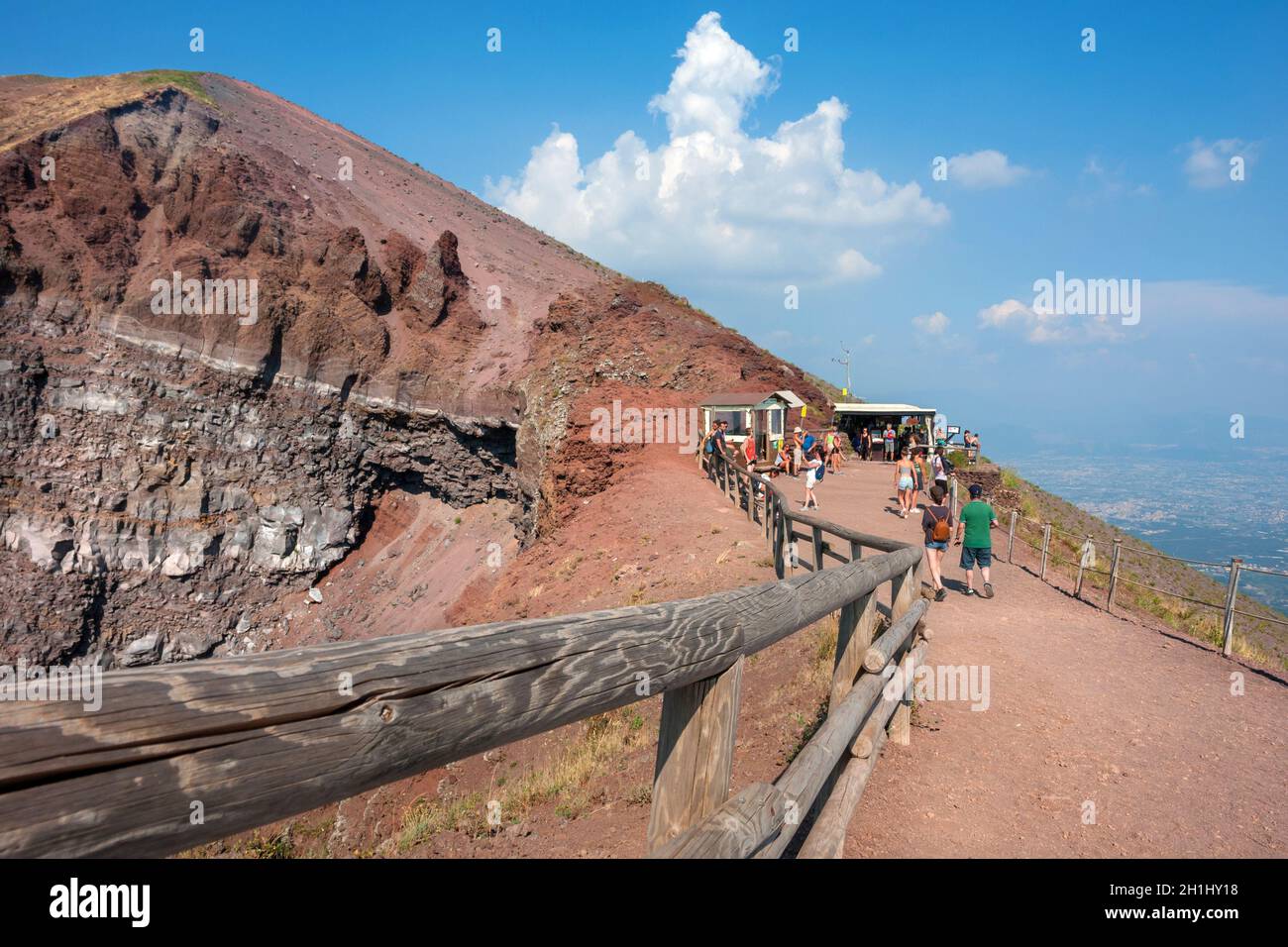 MOUNT VESUVIUS, ITALY - AUGUST 1, 2018: Tourists walk around the crater ...