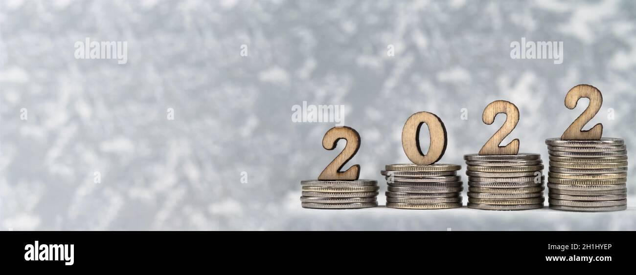 Coins and Figures 2022. Banner 2022. Money stacked in columns Stock ...