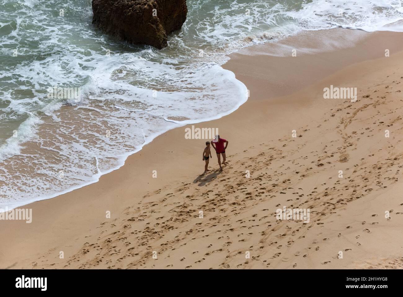 PRAIA DA MARINHA, ALGARVE, PORTUGAL - APRIL 24, 2017: People at the ...