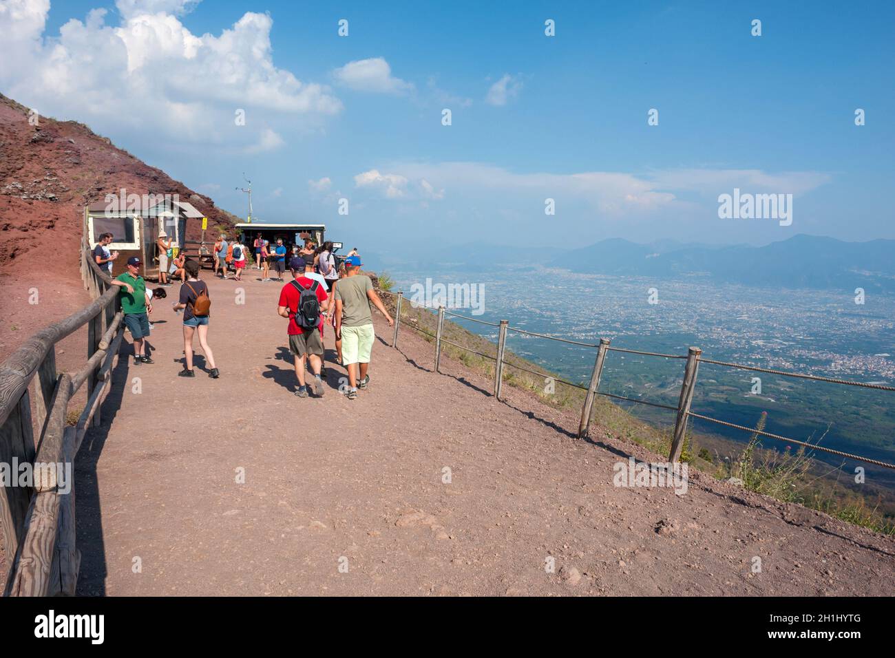MOUNT VESUVIUS, ITALY - AUGUST 1, 2018: Tourists walk around the crater ...