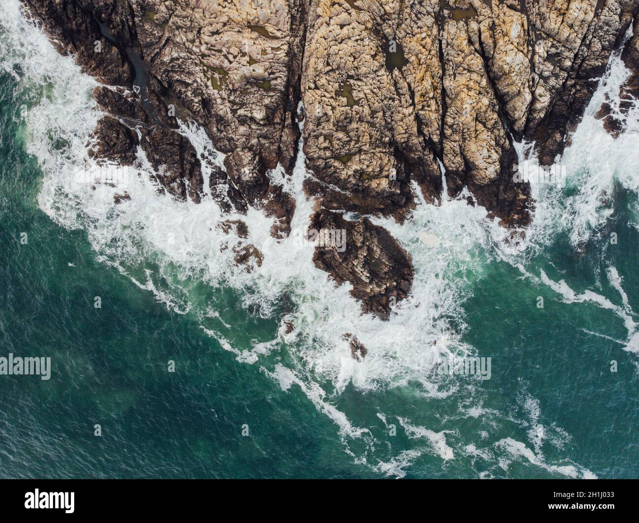Top view of a waving ocean and a rock Stock Photo - Alamy