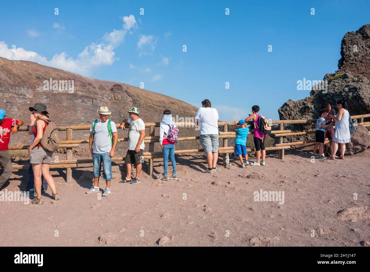 MOUNT VESUVIUS, ITALY - AUGUST 1, 2018: Tourists walk around the crater ...