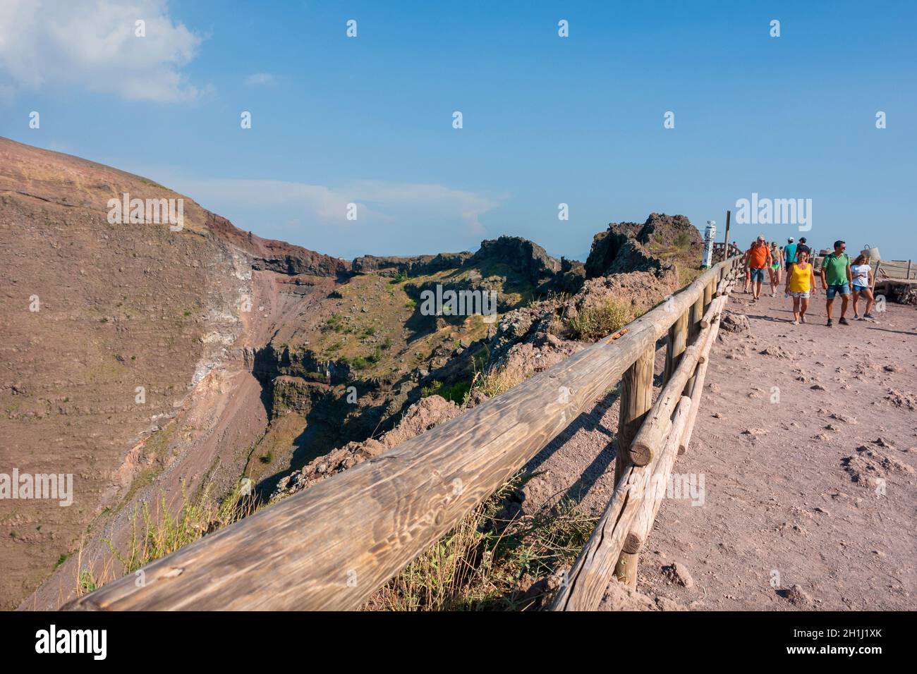 MOUNT VESUVIUS, ITALY - AUGUST 1, 2018: Tourists walk around the crater ...