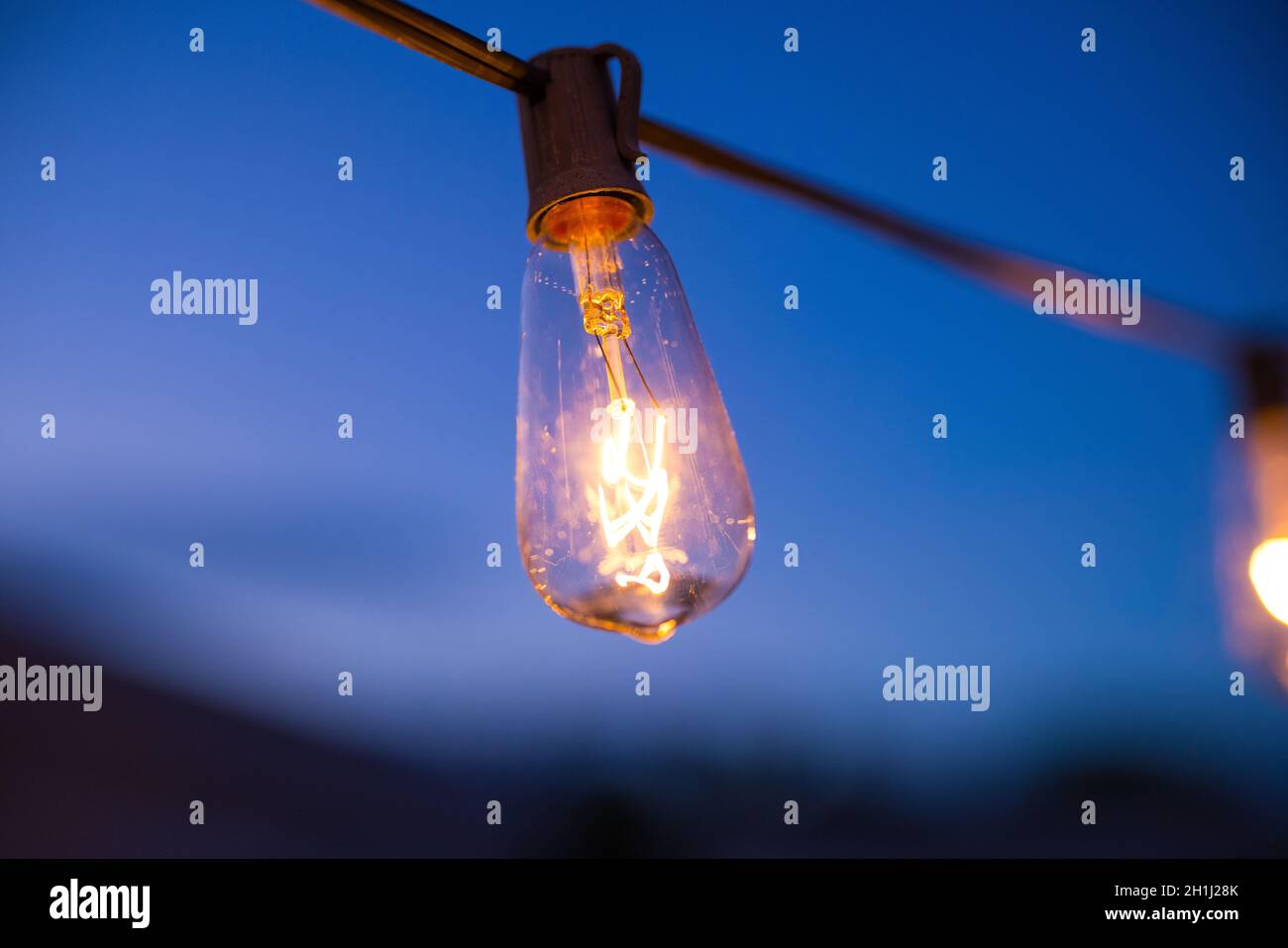 Edison Light Above Rooftop Patio Stock Photo - Alamy