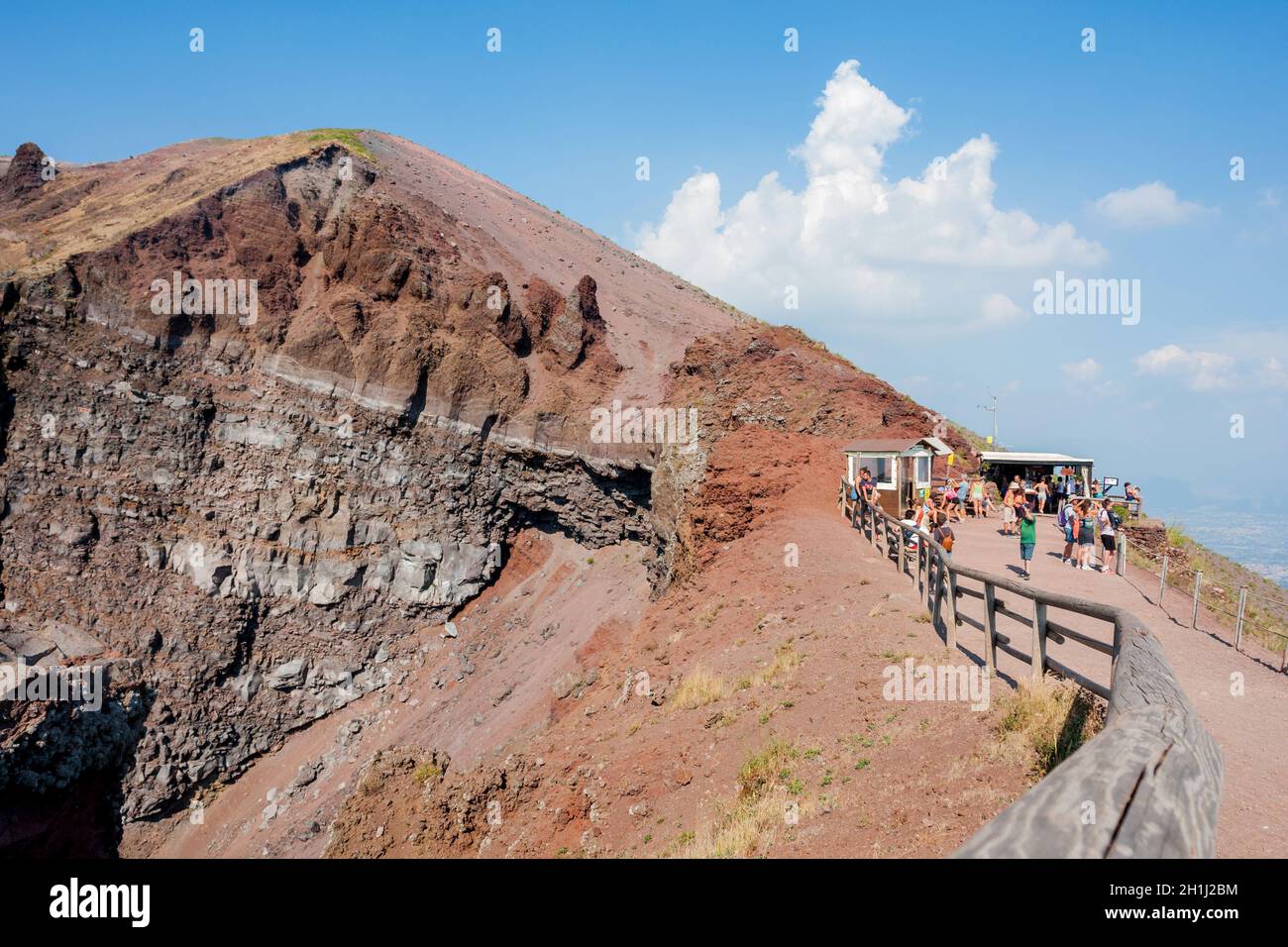 MOUNT VESUVIUS, ITALY - AUGUST 1, 2018: Tourists walk around the crater ...