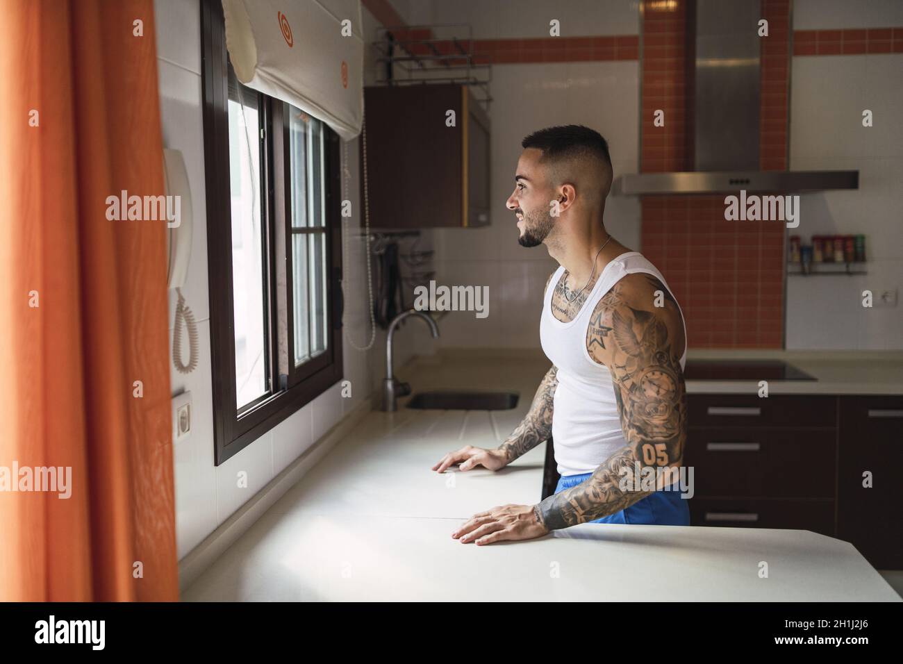 Adult look out window of home hi-res stock photography and images - Alamy