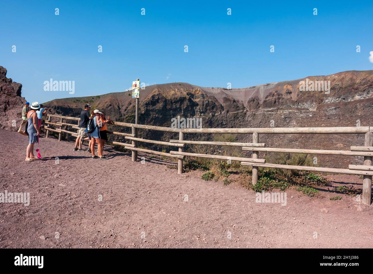 MOUNT VESUVIUS, ITALY - AUGUST 1, 2018: Tourists walk around the crater ...