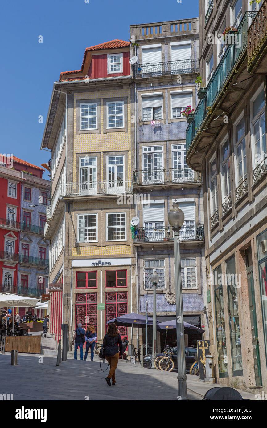 PORTO, PORTUGAL - April 17, 2017: People walking at Old Town street of ...