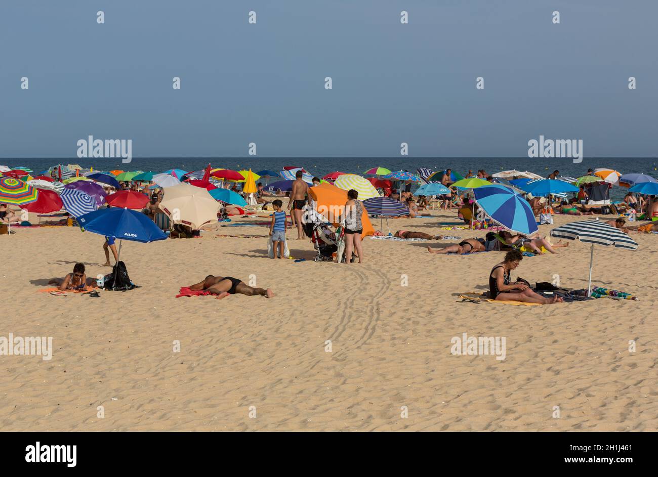 MANTA ROTA, PORTUGAL - AUGUST 25, 2017: People at the famous beach of ...
