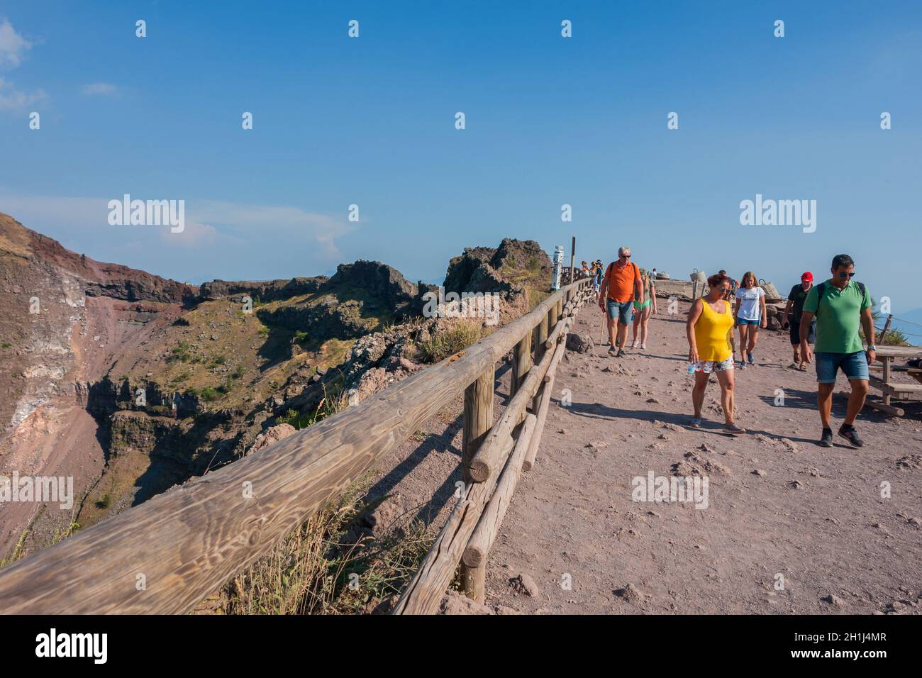 MOUNT VESUVIUS, ITALY - AUGUST 1, 2018: Tourists walk around the crater ...