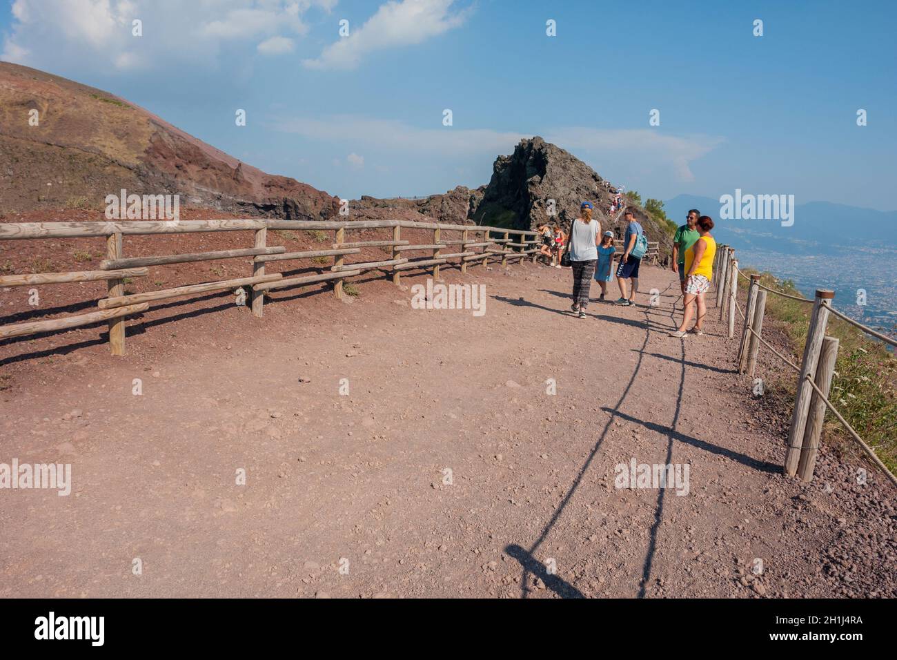 MOUNT VESUVIUS, ITALY - AUGUST 1, 2018: Tourists walk around the crater ...