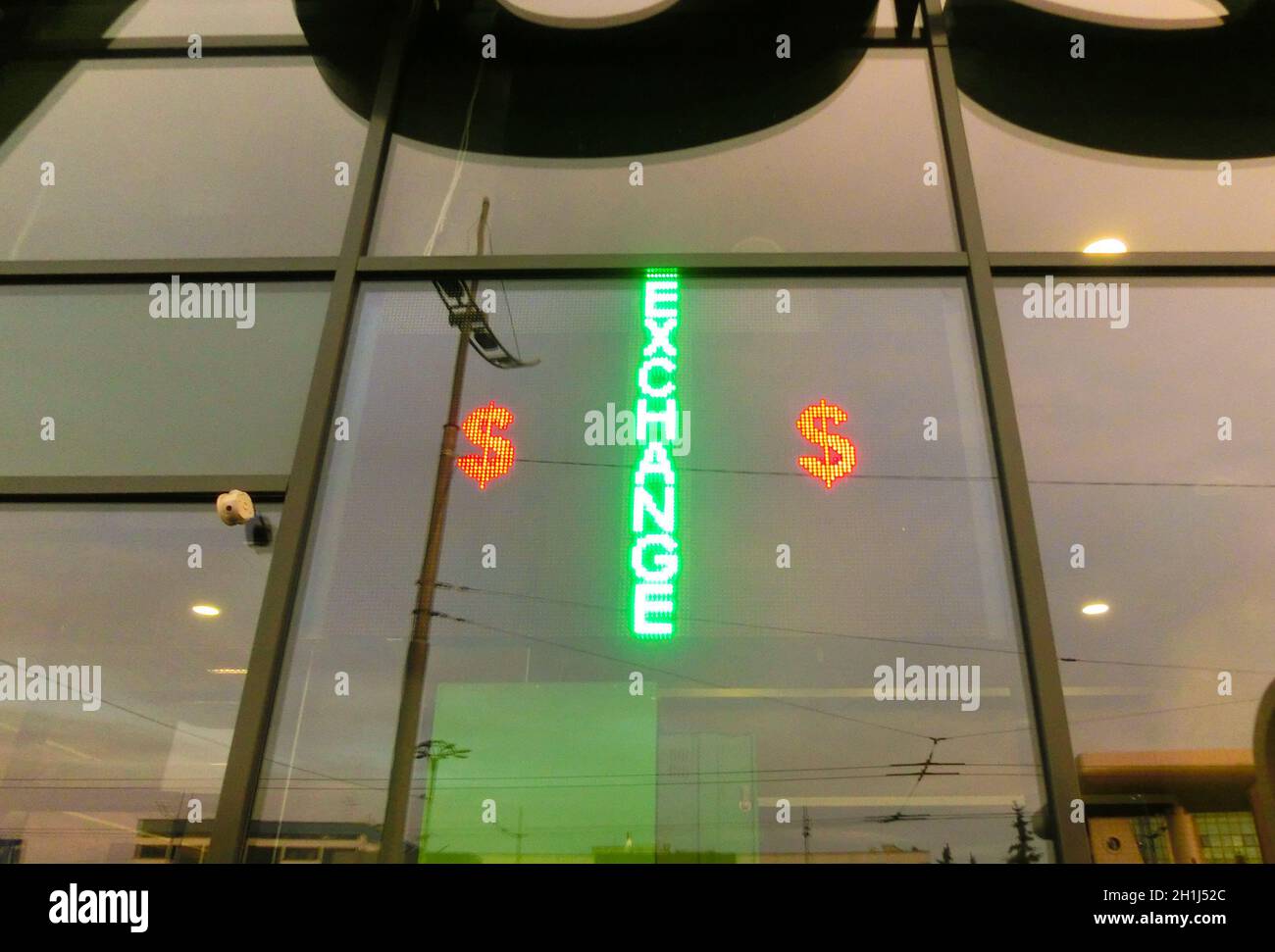Glowing sign - currency exchange- next to a currency exchange point is ...