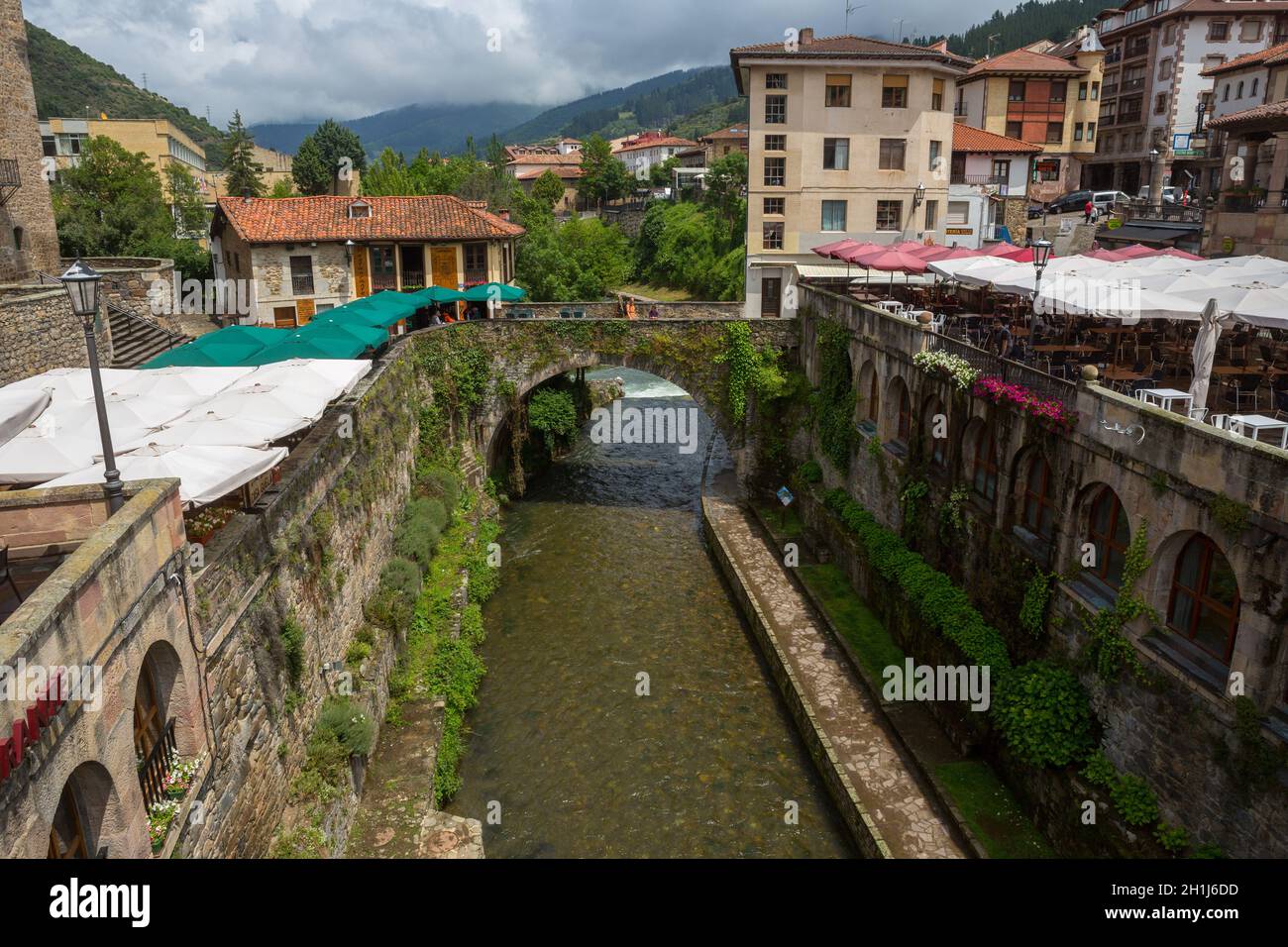 Potes, Spain - June 1, 2018: The traditional houses in the ancient ...