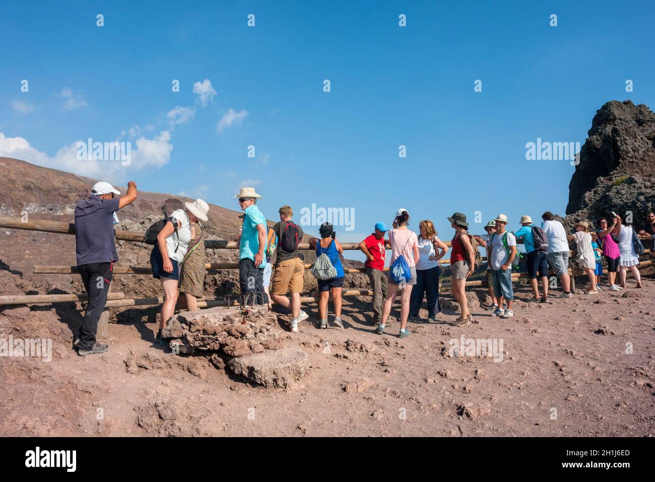 MOUNT VESUVIUS, ITALY - AUGUST 1, 2018: Tourists walk around the crater ...