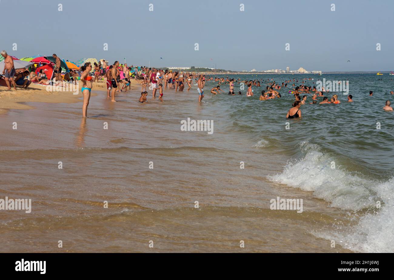 MANTA ROTA, PORTUGAL - AUGUST 25, 2017: People at the famous beach of ...