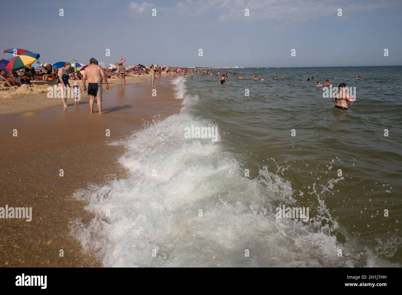 MANTA ROTA, PORTUGAL - AUGUST 25, 2017: People at the famous beach of ...
