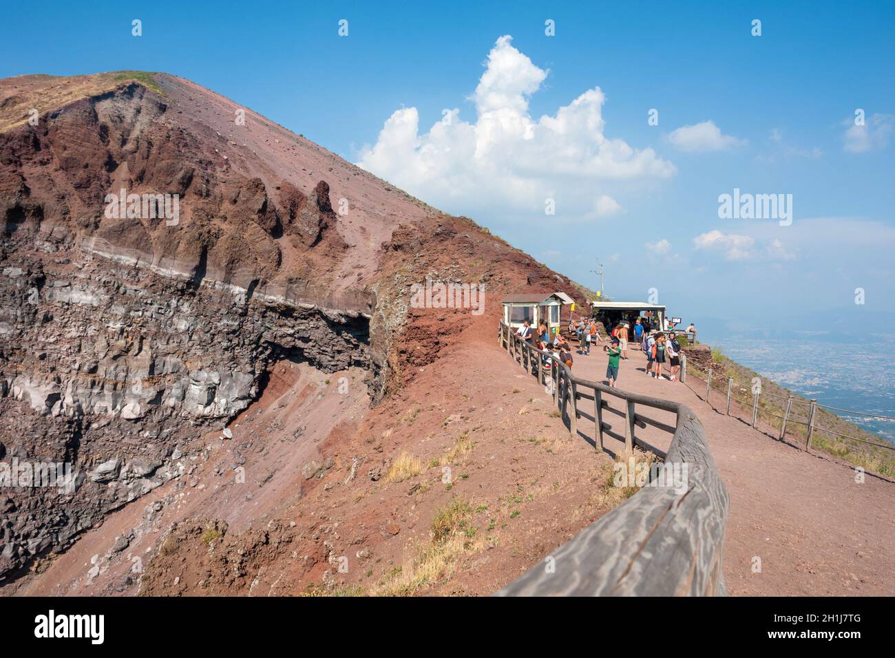 MOUNT VESUVIUS, ITALY - AUGUST 1, 2018: Tourists walk around the crater ...
