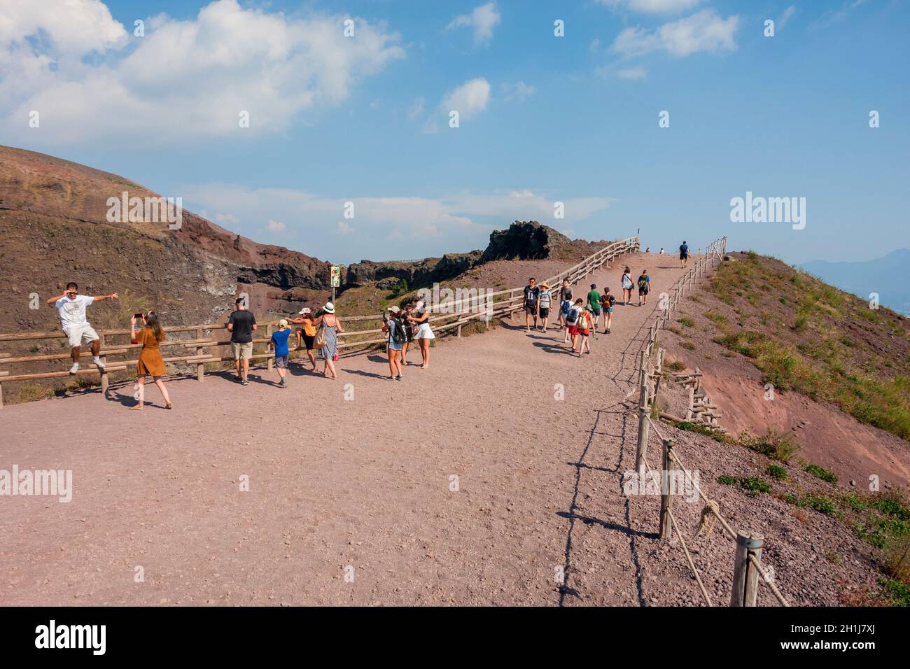 MOUNT VESUVIUS, ITALY - AUGUST 1, 2018: Tourists walk around the crater ...