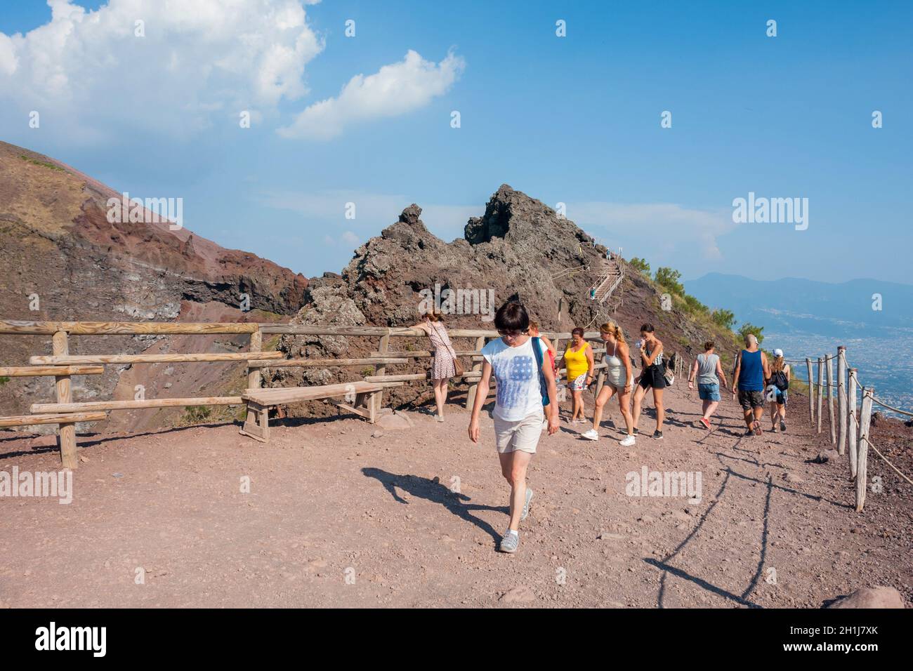 MOUNT VESUVIUS, ITALY - AUGUST 1, 2018: Tourists walk around the crater ...