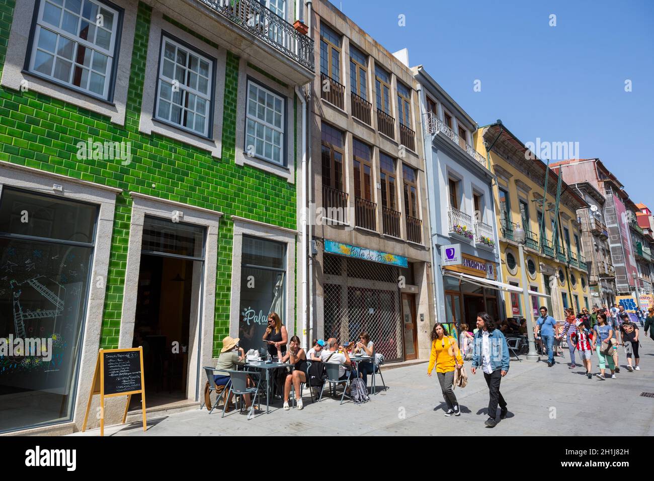 PORTO, PORTUGAL - April 17, 2017: People walking at Old Town street of ...