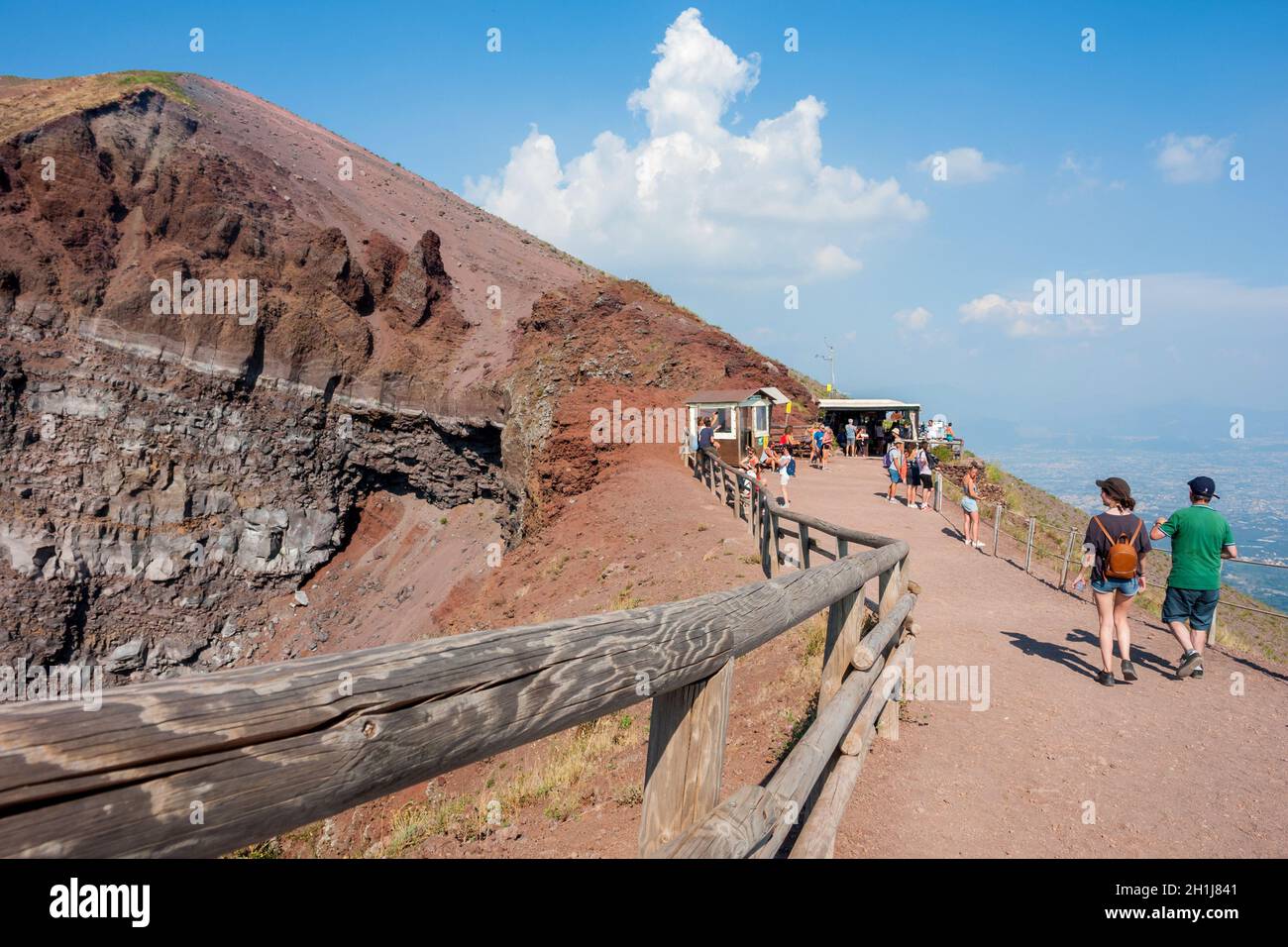 MOUNT VESUVIUS, ITALY - AUGUST 1, 2018: Tourists walk around the crater ...