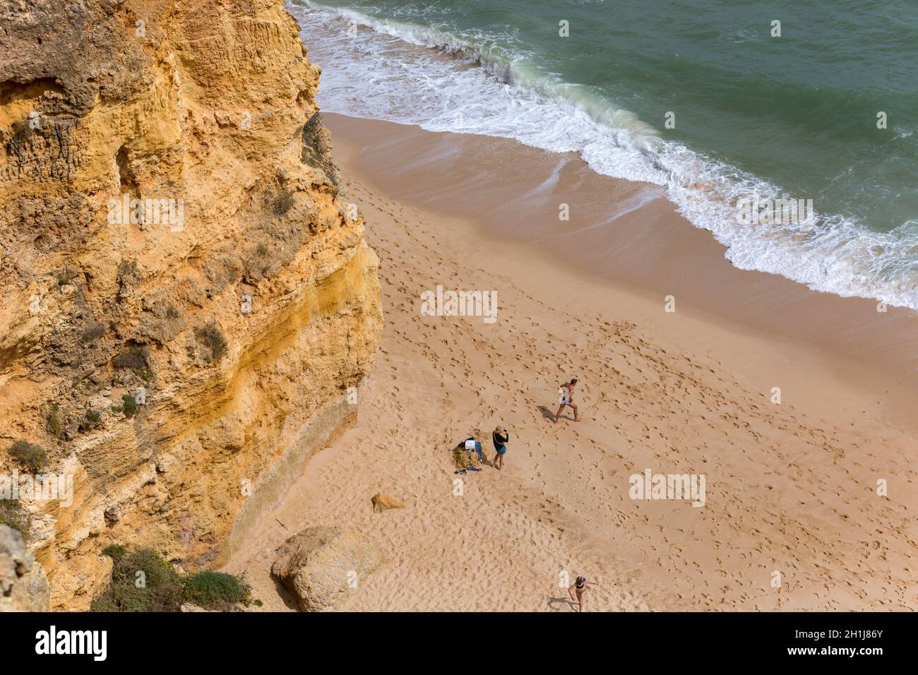 PRAIA DA MARINHA, ALGARVE, PORTUGAL - APRIL 24, 2017: People at the ...