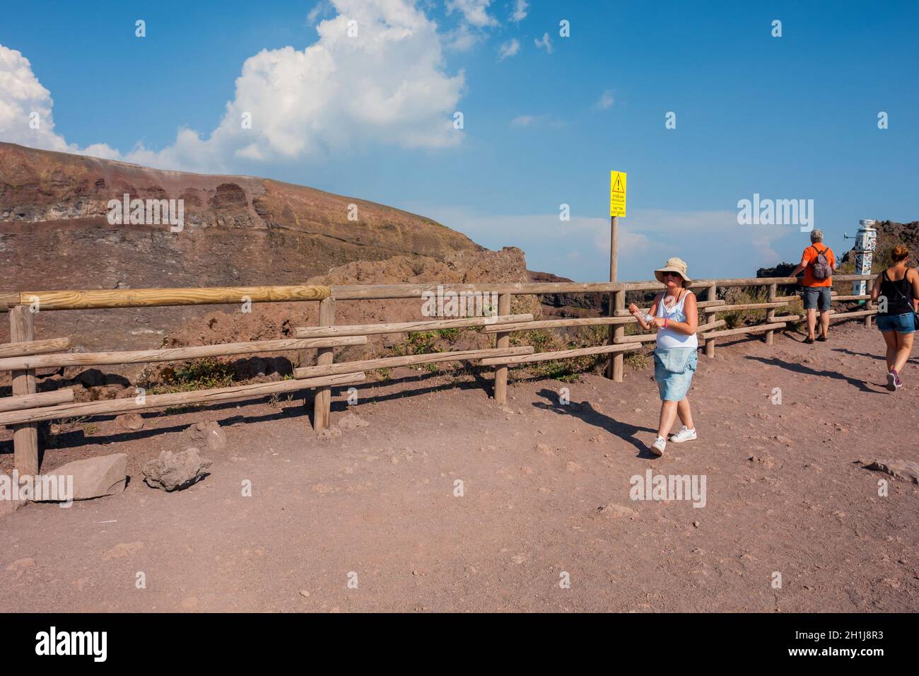 MOUNT VESUVIUS, ITALY - AUGUST 1, 2018: Tourists walk around the crater ...