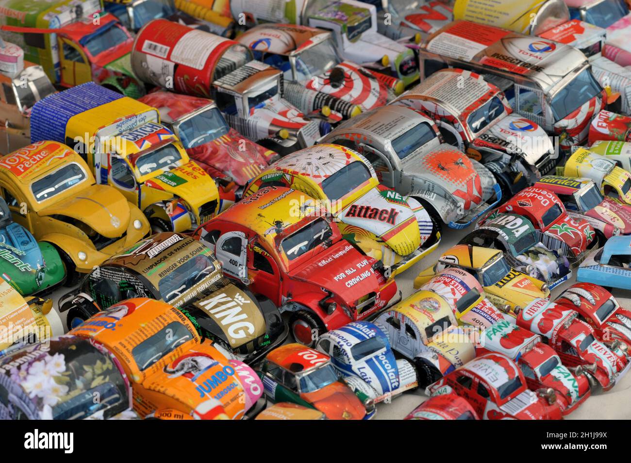 Selection of toy cars made from old auminium cans for sale on a stall ...