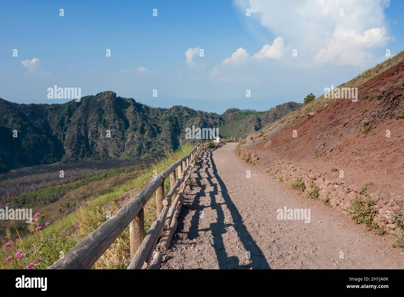 MOUNT VESUVIUS, ITALY - AUGUST 1, 2018: Tourists walk around the crater ...