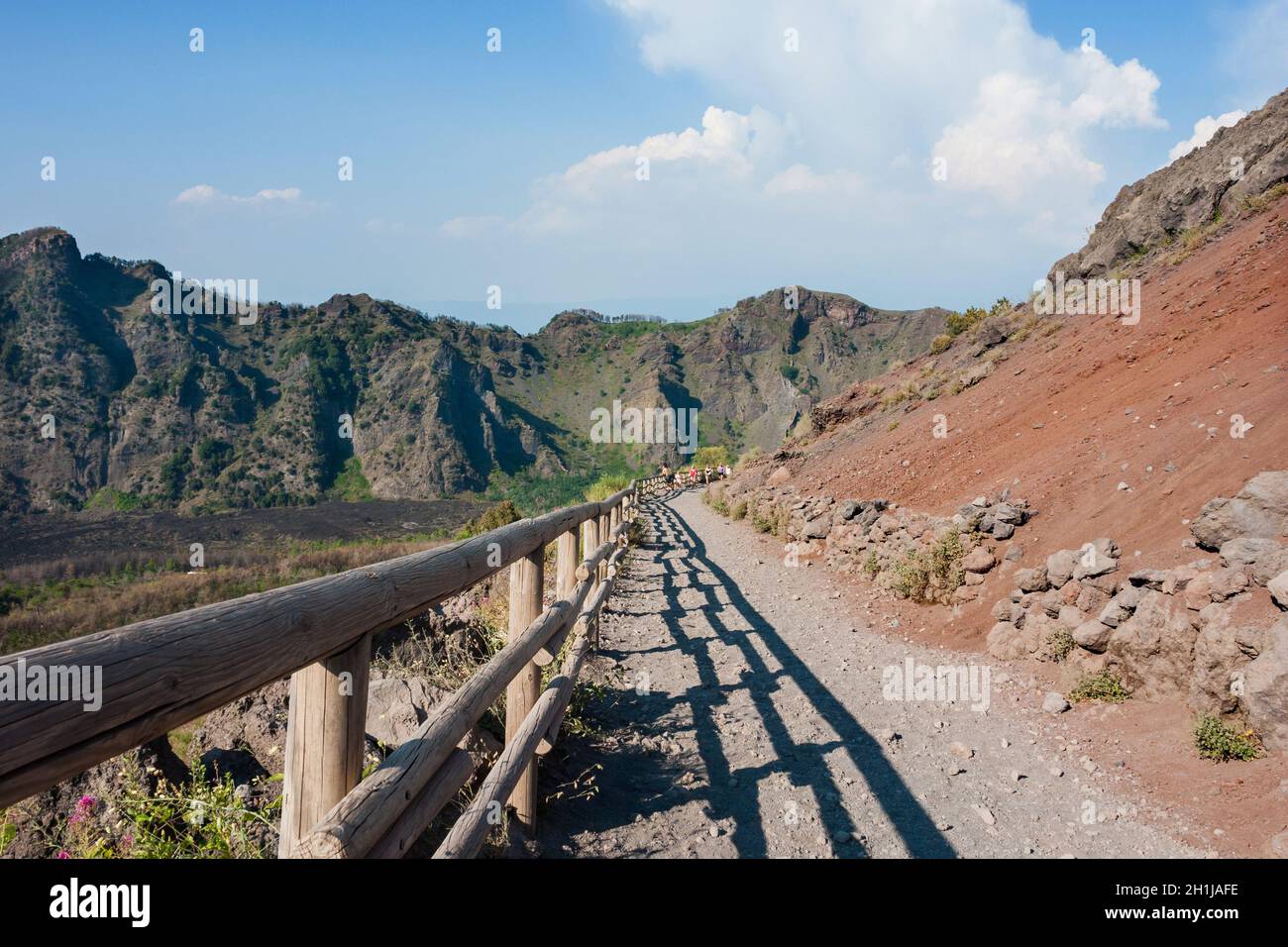 MOUNT VESUVIUS, ITALY - AUGUST 1, 2018: Tourists walk around the crater ...