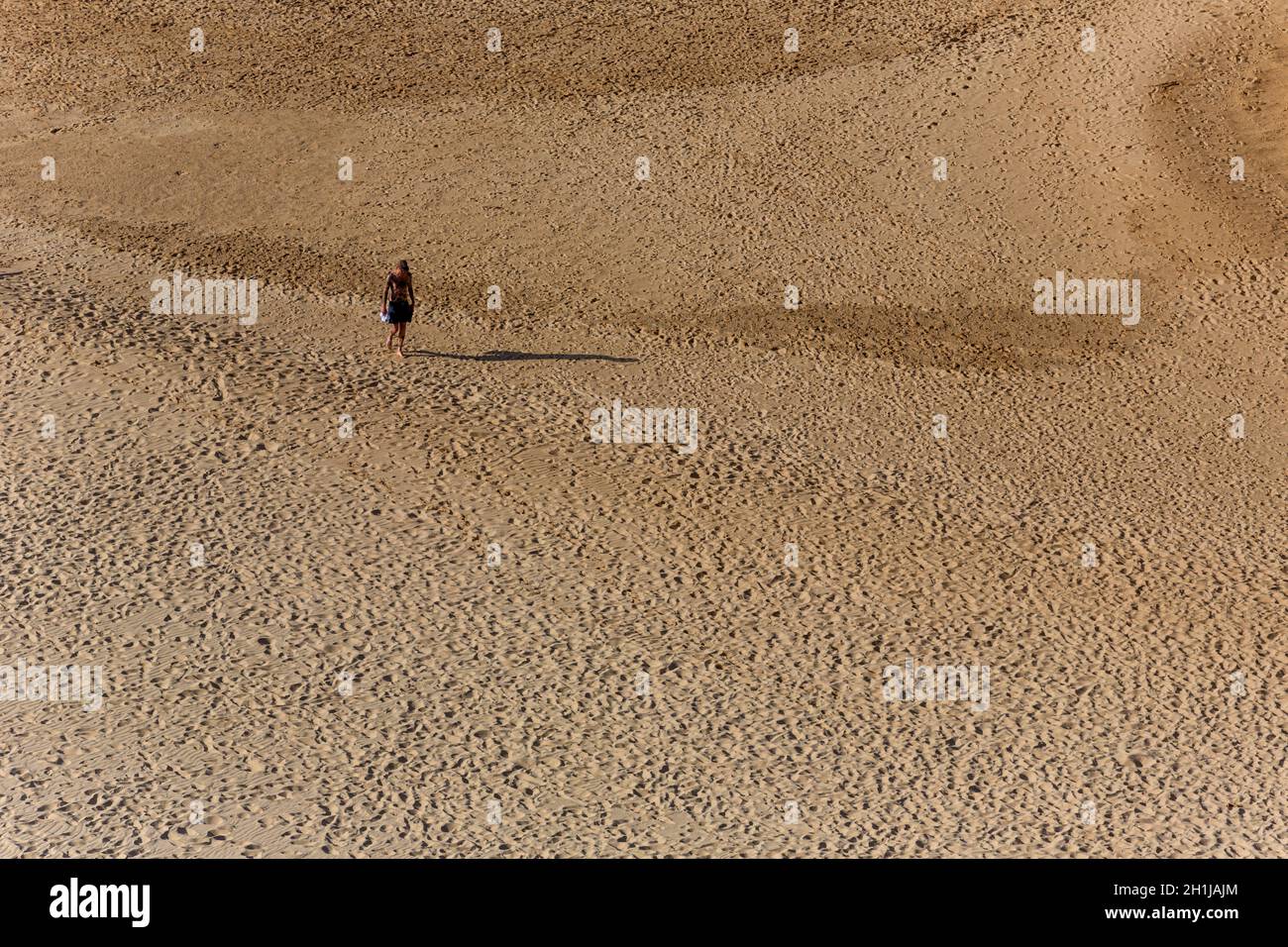 PRAIA DA ROCHA, PORTUGAL - APRIL 23, 2017: Man walking at the famous ...