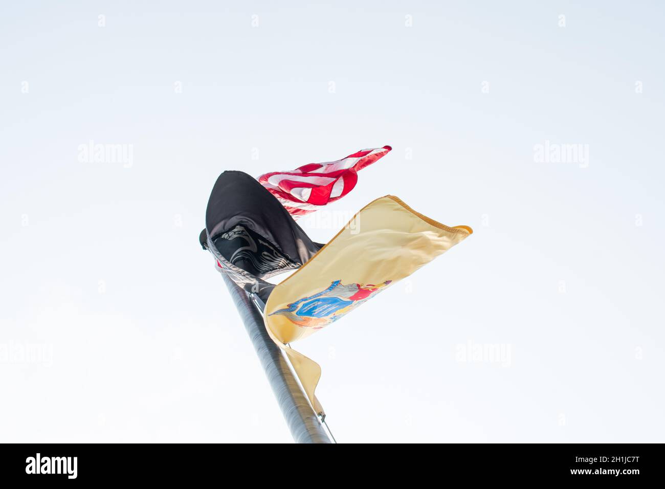 Three Flags Flying in a Grey Sky, One Being a US Flag Stock Photo - Alamy