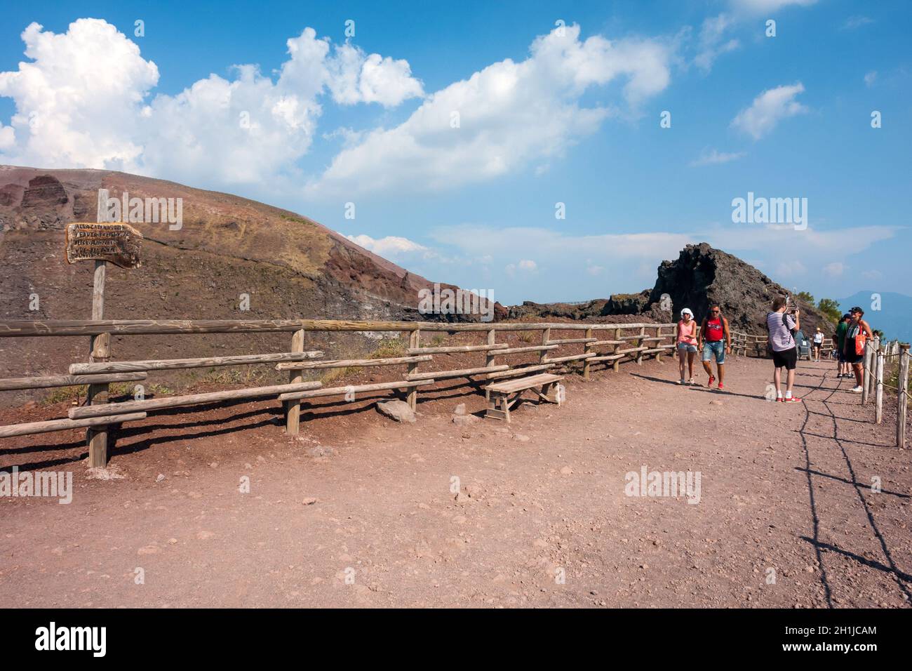 MOUNT VESUVIUS, ITALY - AUGUST 1, 2018: Tourists walk around the crater ...