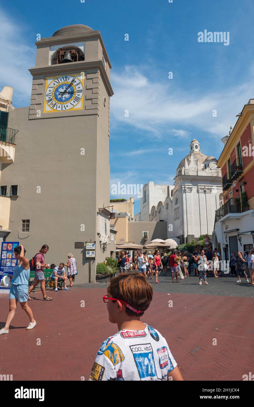 CAPRI, ITALY - JULY 29, 2018: Tourists visit Piazza Umberto I, the most ...