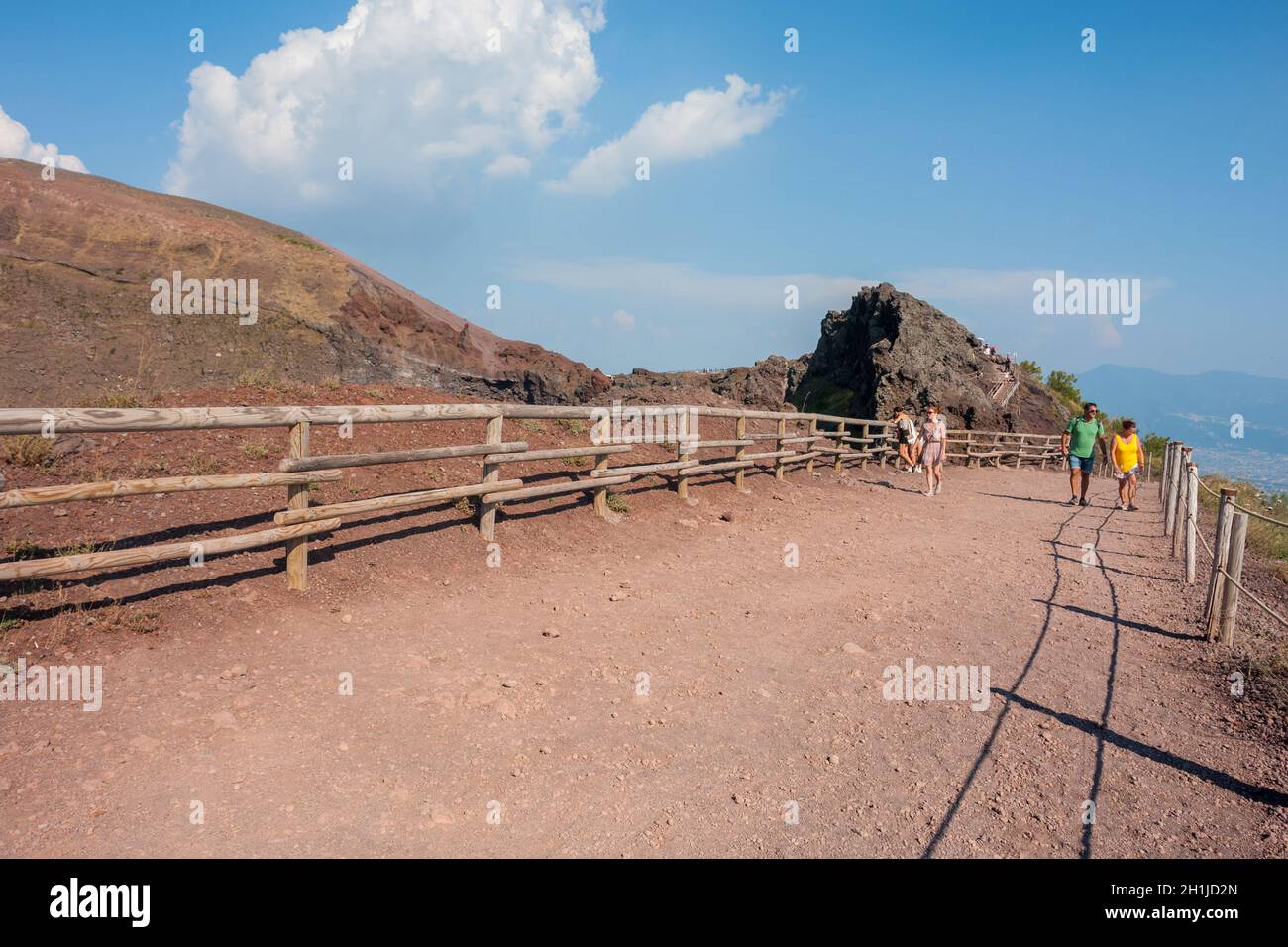 MOUNT VESUVIUS, ITALY - AUGUST 1, 2018: Tourists walk around the crater ...