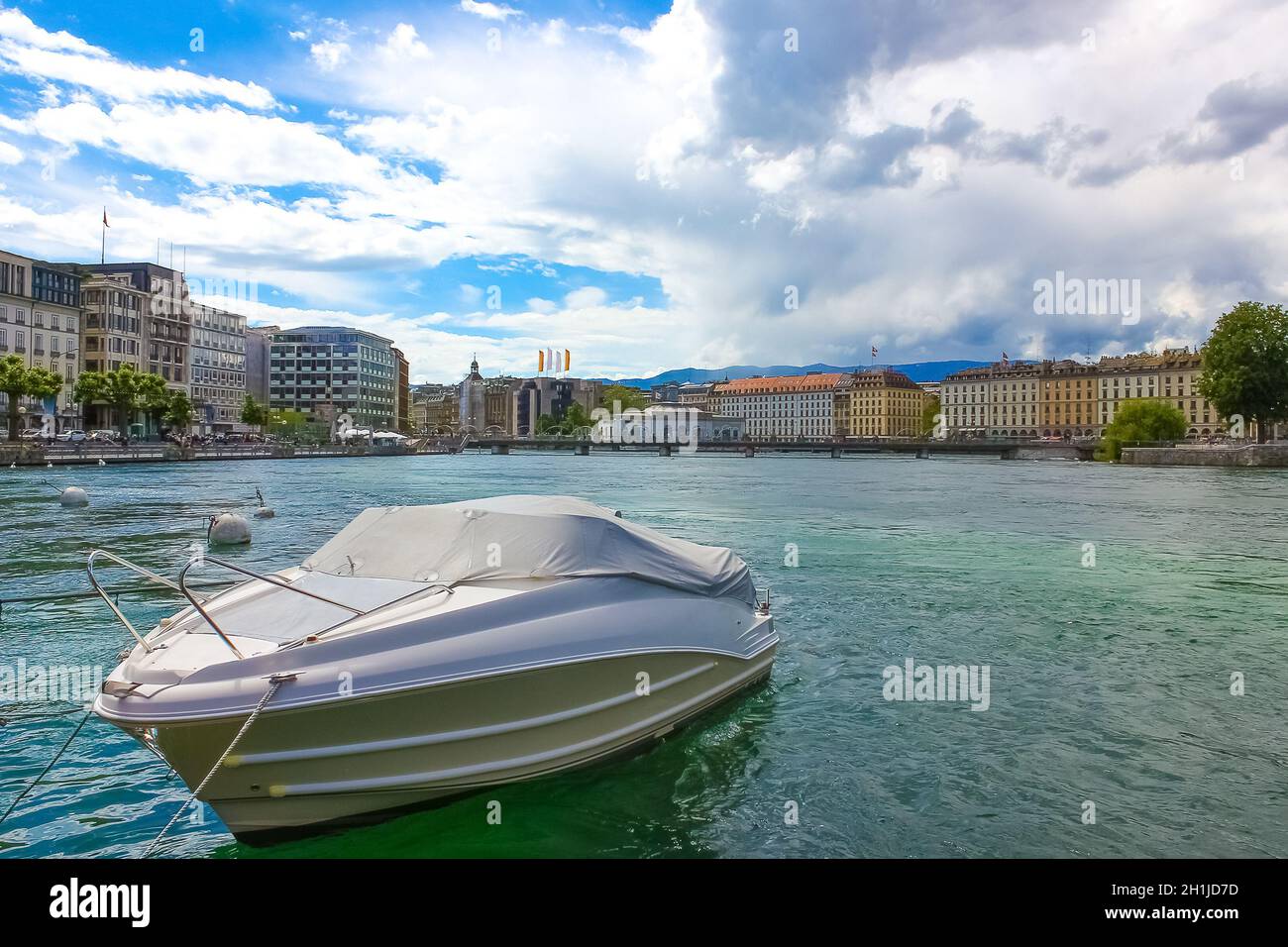 Lake Geneva. Panoramic view of harbor district with blue sky and clouds ...